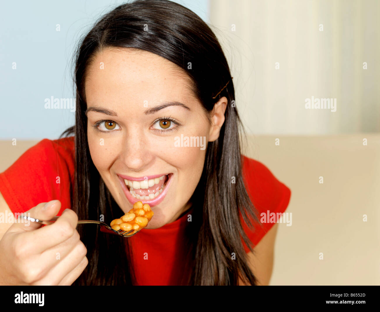 Young Woman Eating Baked Beans Model Released Stock Photo - Alamy