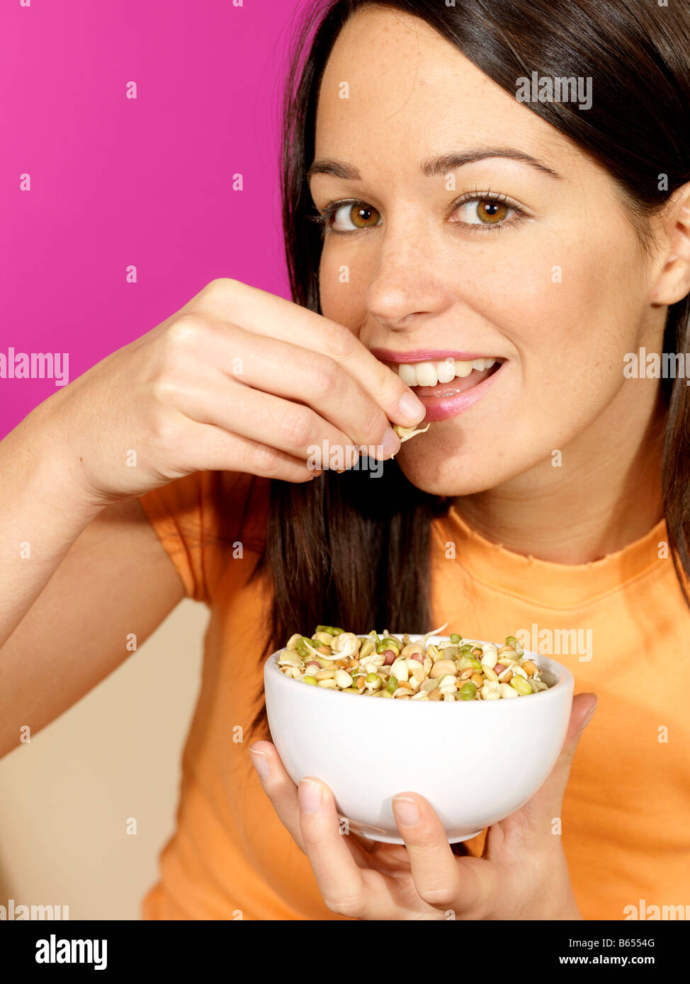 Young Woman Eating Mixed Beans Model Released Stock Photo - Alamy