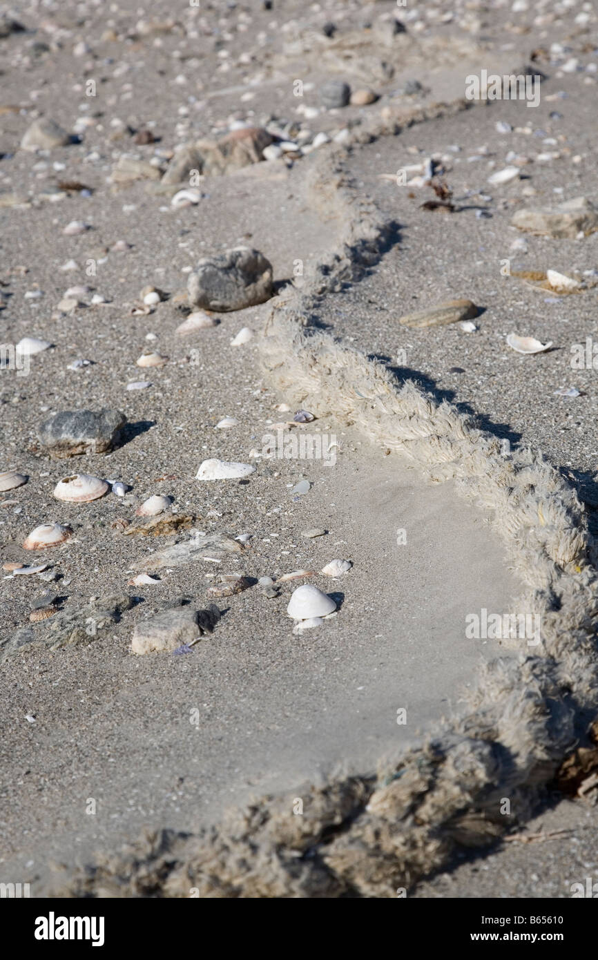 Rope in Sand Stock Photo - Alamy