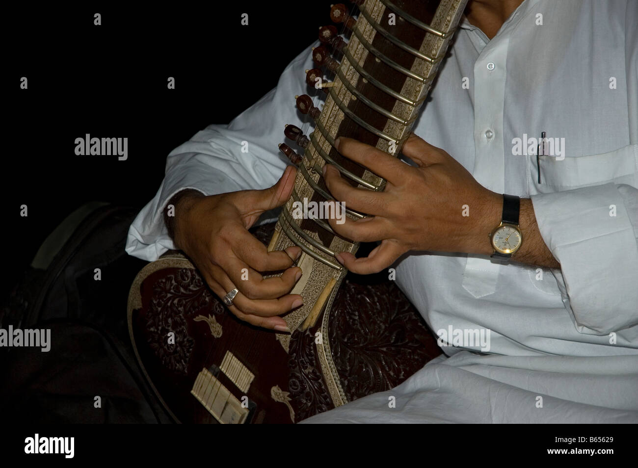 Close up photo of a musician playing the sitar in Varanasi India Stock ...