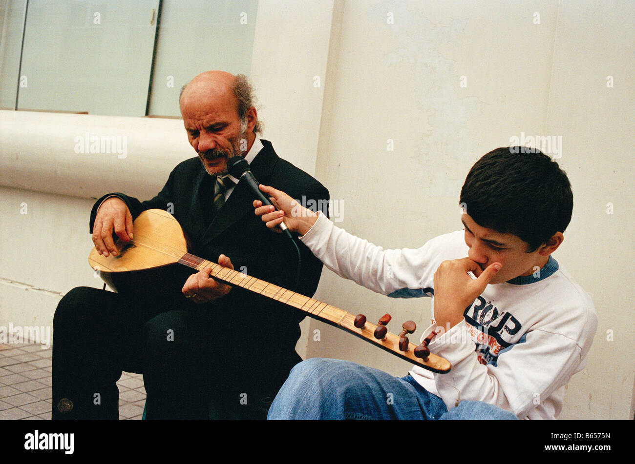 Playing baglama hi-res stock photography and images - Alamy