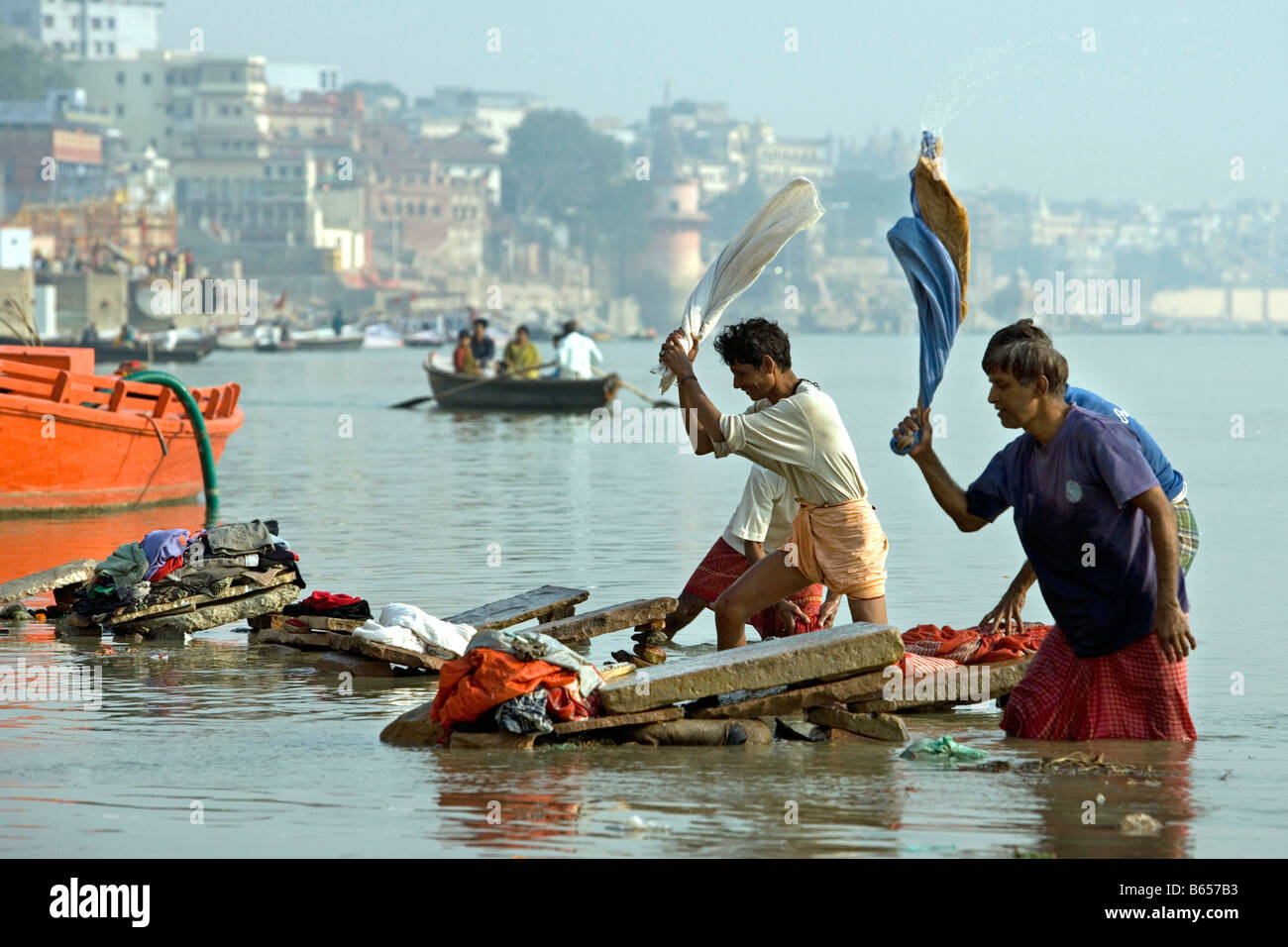 India, Uttar Pradesh, Varanasi, Ganga river, People washing clothes ...