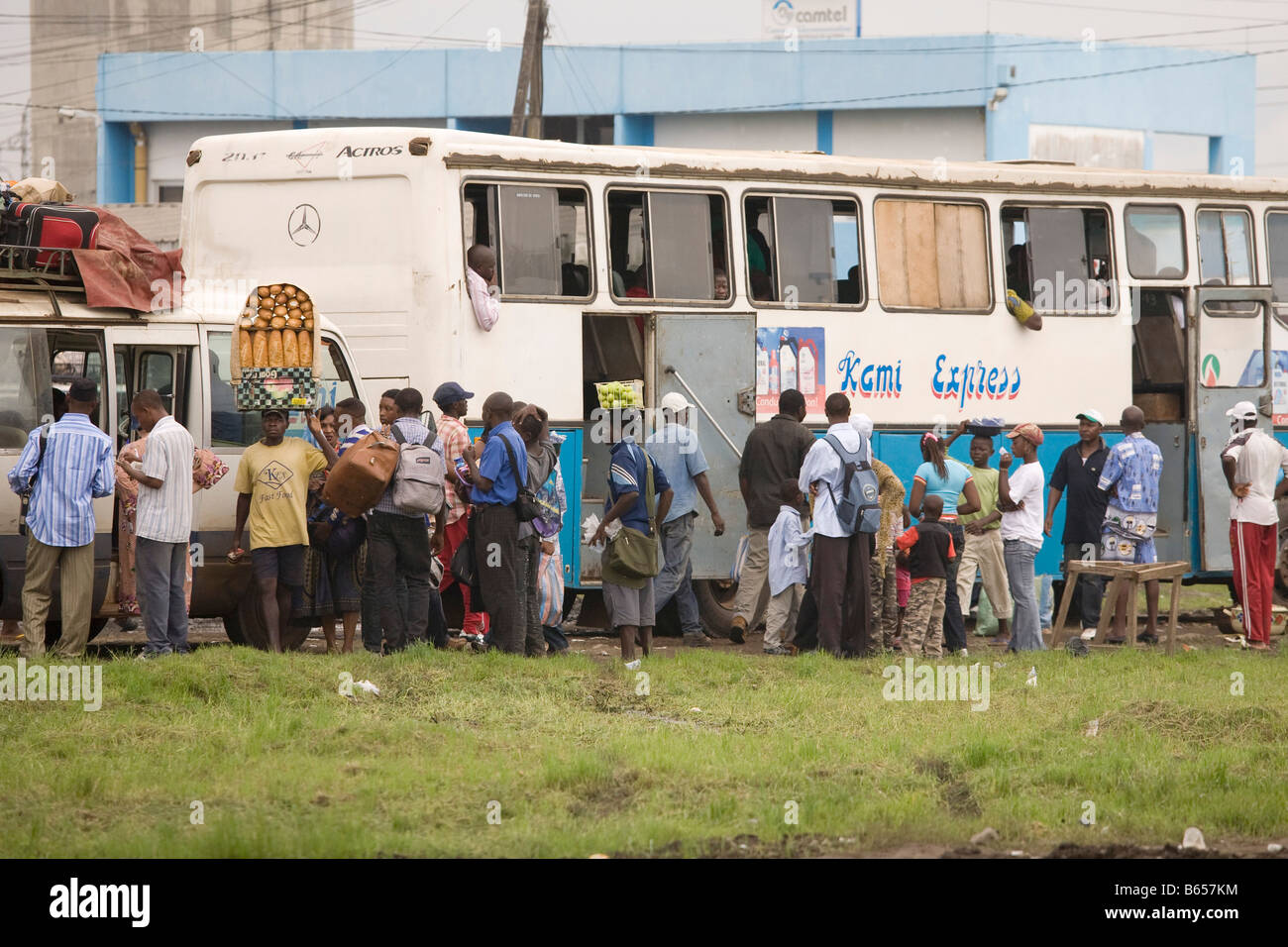 People waiting in minibus queue at bus station, Douala, Cameroon ...