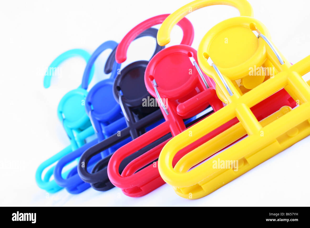 colorful laundry hangers isolated on white background Stock Photo - Alamy