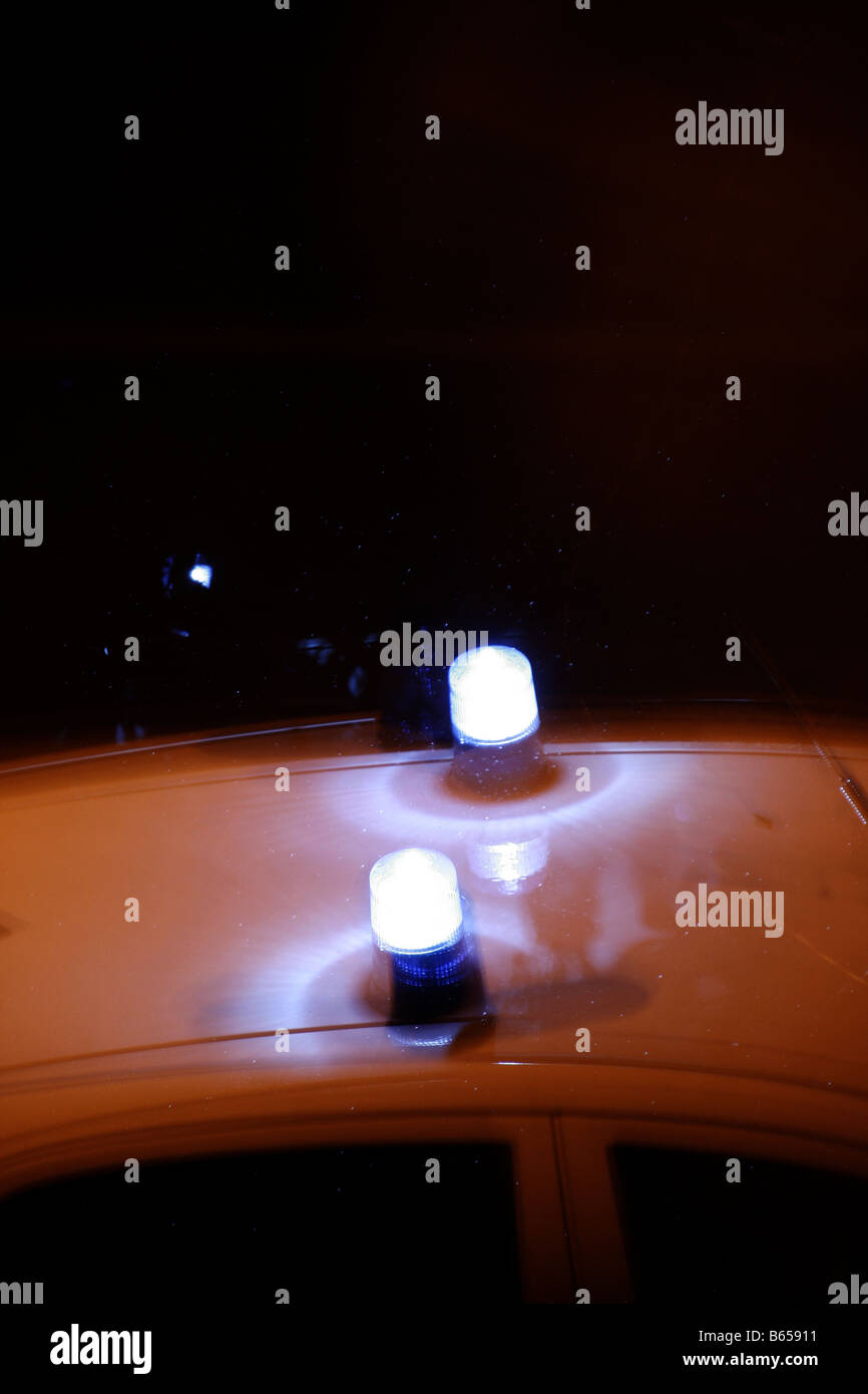 fast police car driving in heavy rain at night in town Stock Photo - Alamy