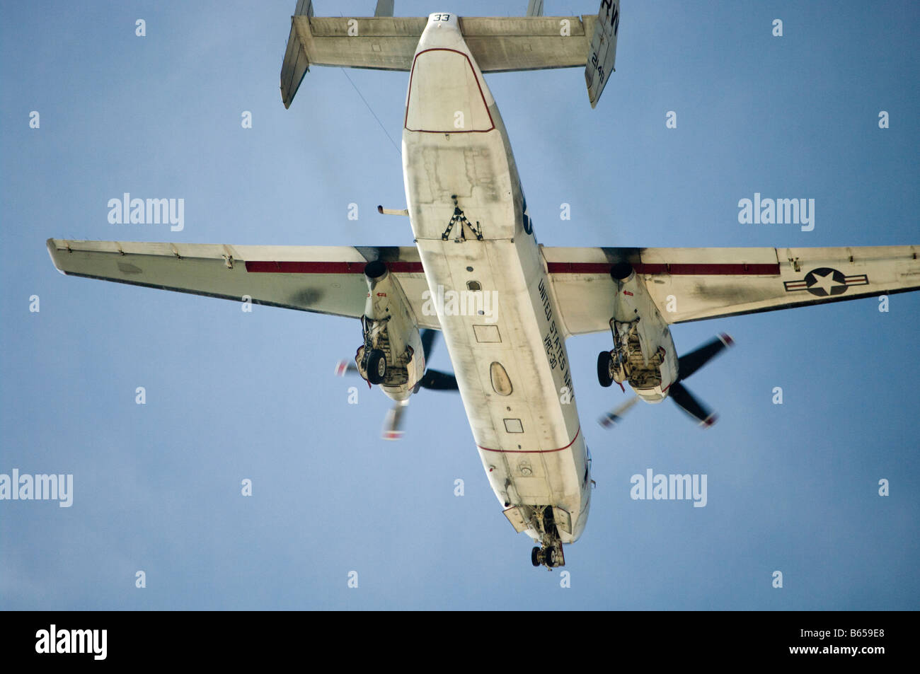 Underside view of a landing C-2 Greyhound US Navy aircraft, from ...