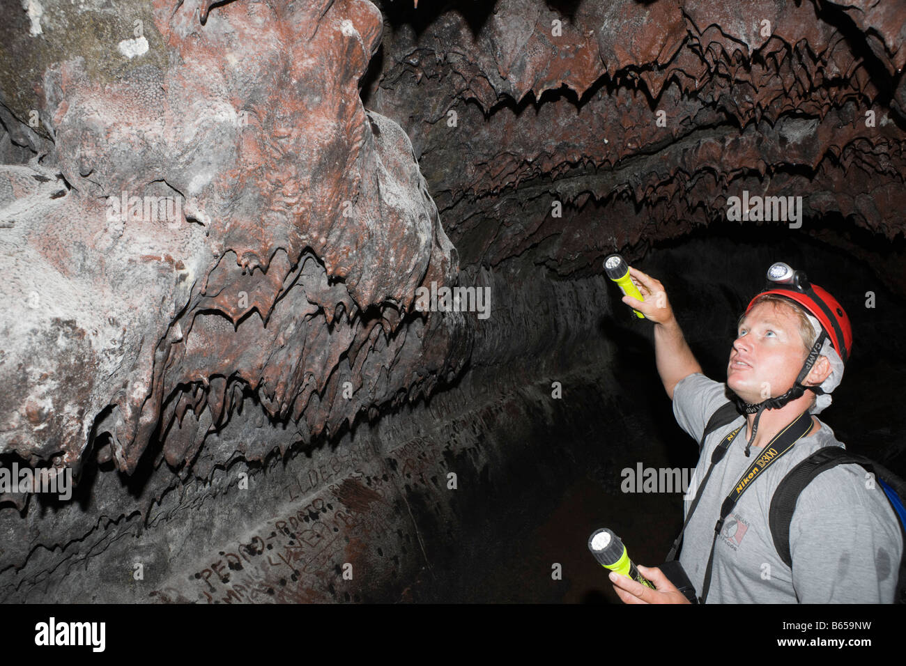Tourist in biggest Portugese Volcanic Cave Gruta das Torres Pico Island ...