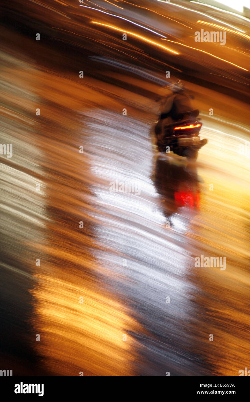 fast motorbike rider heavy rain at night in town Stock Photo - Alamy