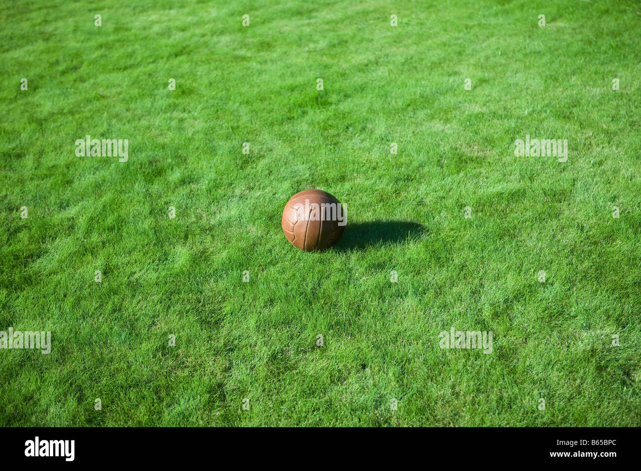 Ball on grass Stock Photo - Alamy