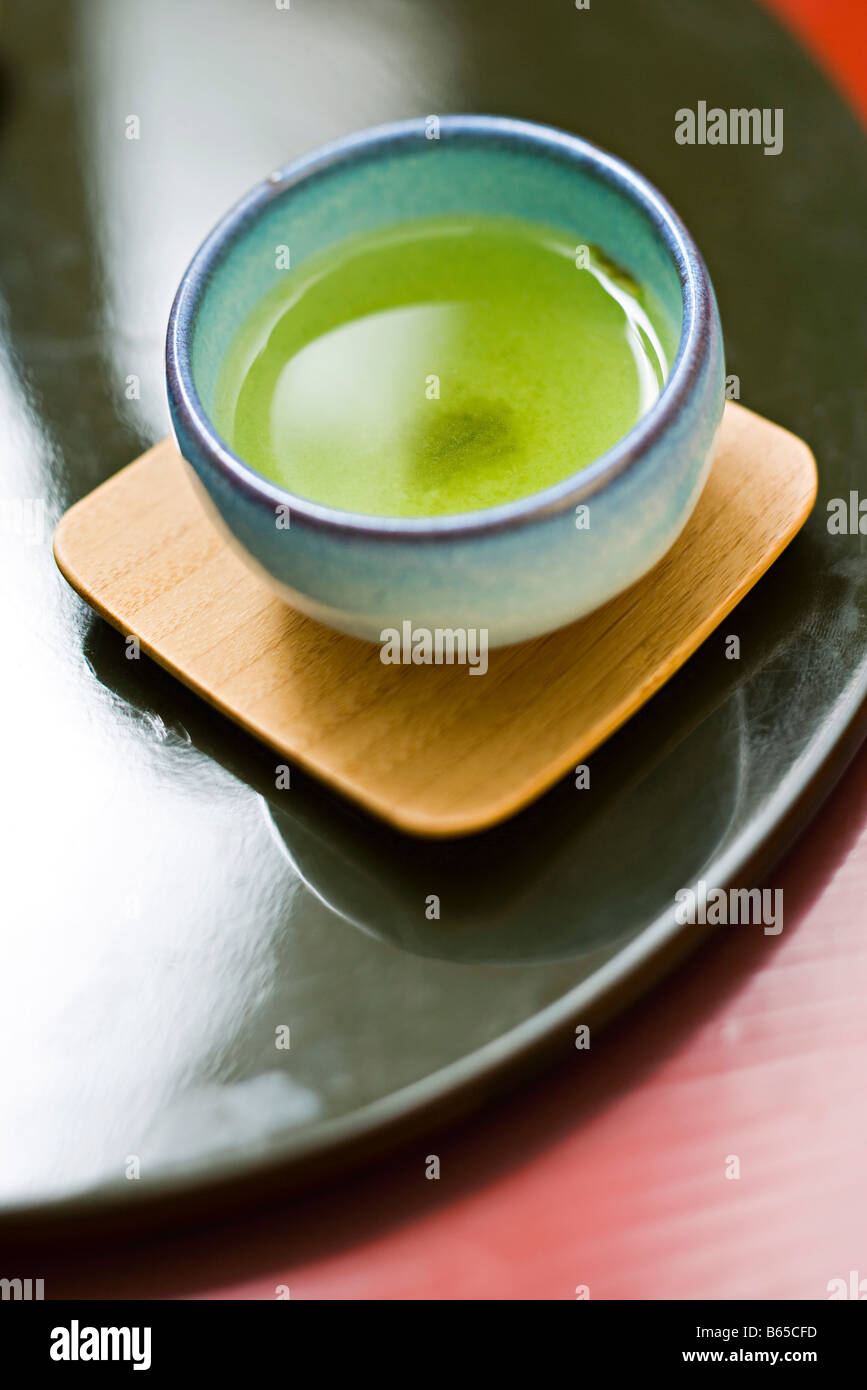 Cup of green tea with sediment in bottom Stock Photo - Alamy