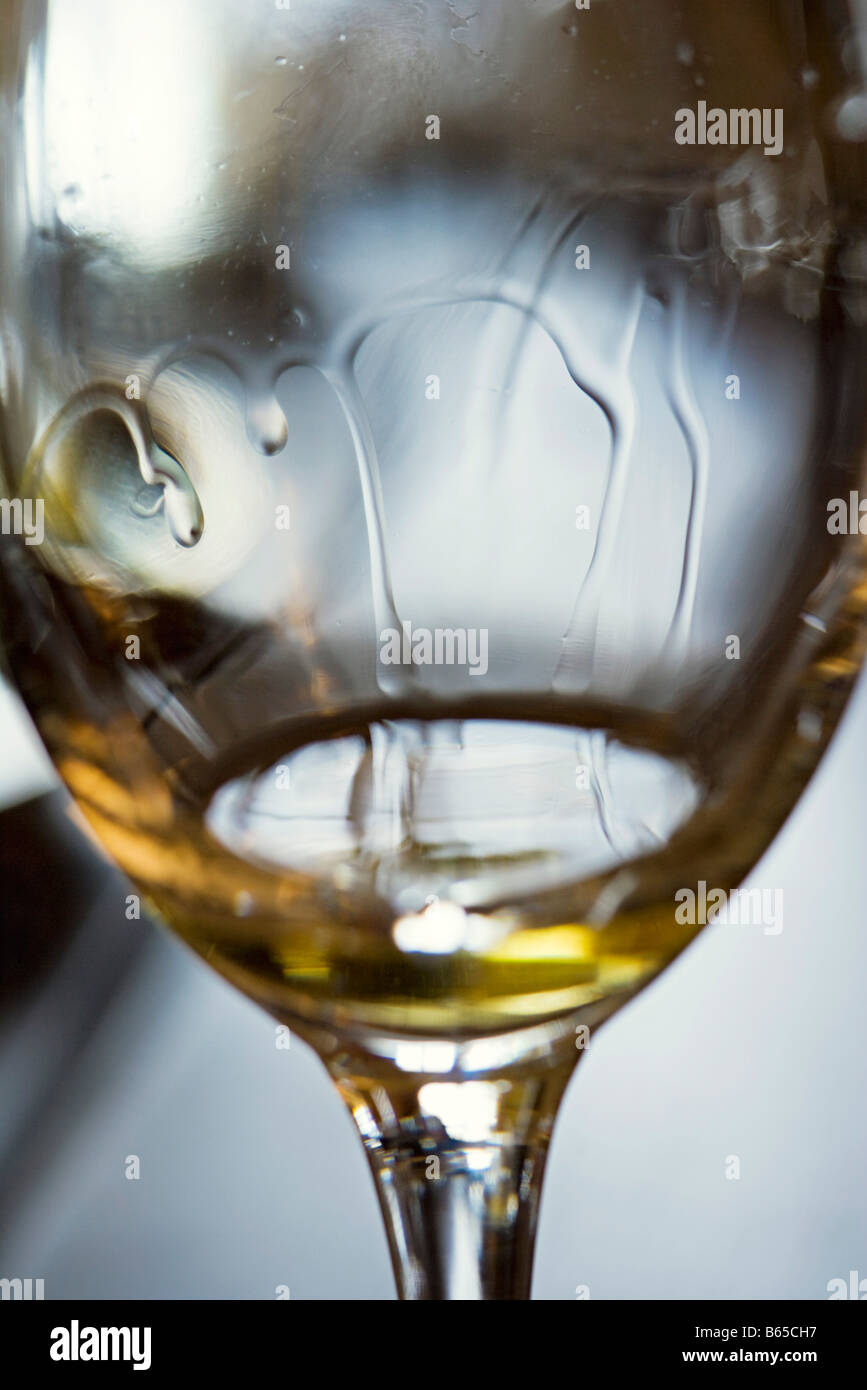 White wine dripping down inside of wine glass, extreme close-up Stock ...