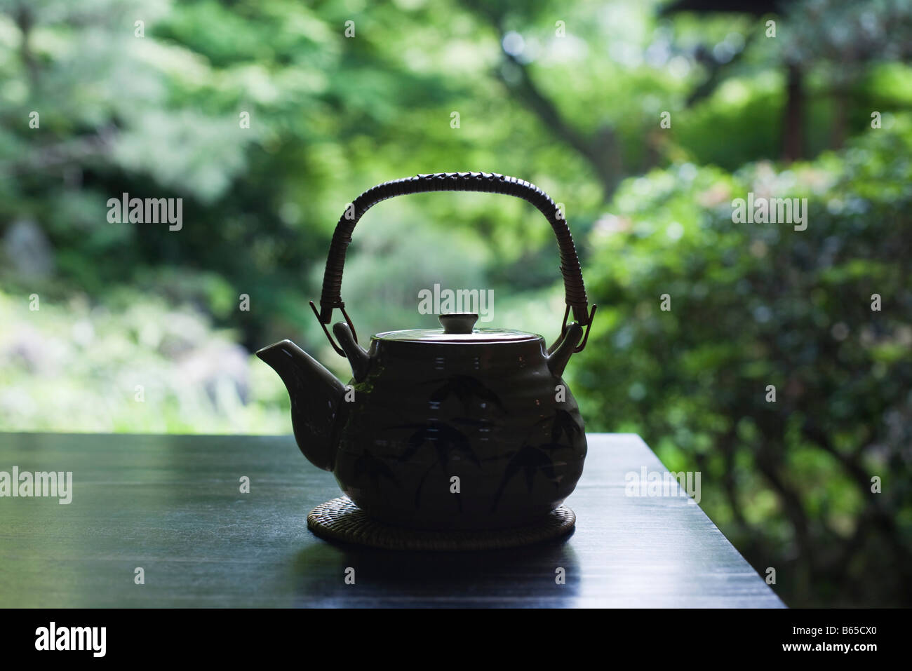 Teapot on table outdoors Stock Photo - Alamy