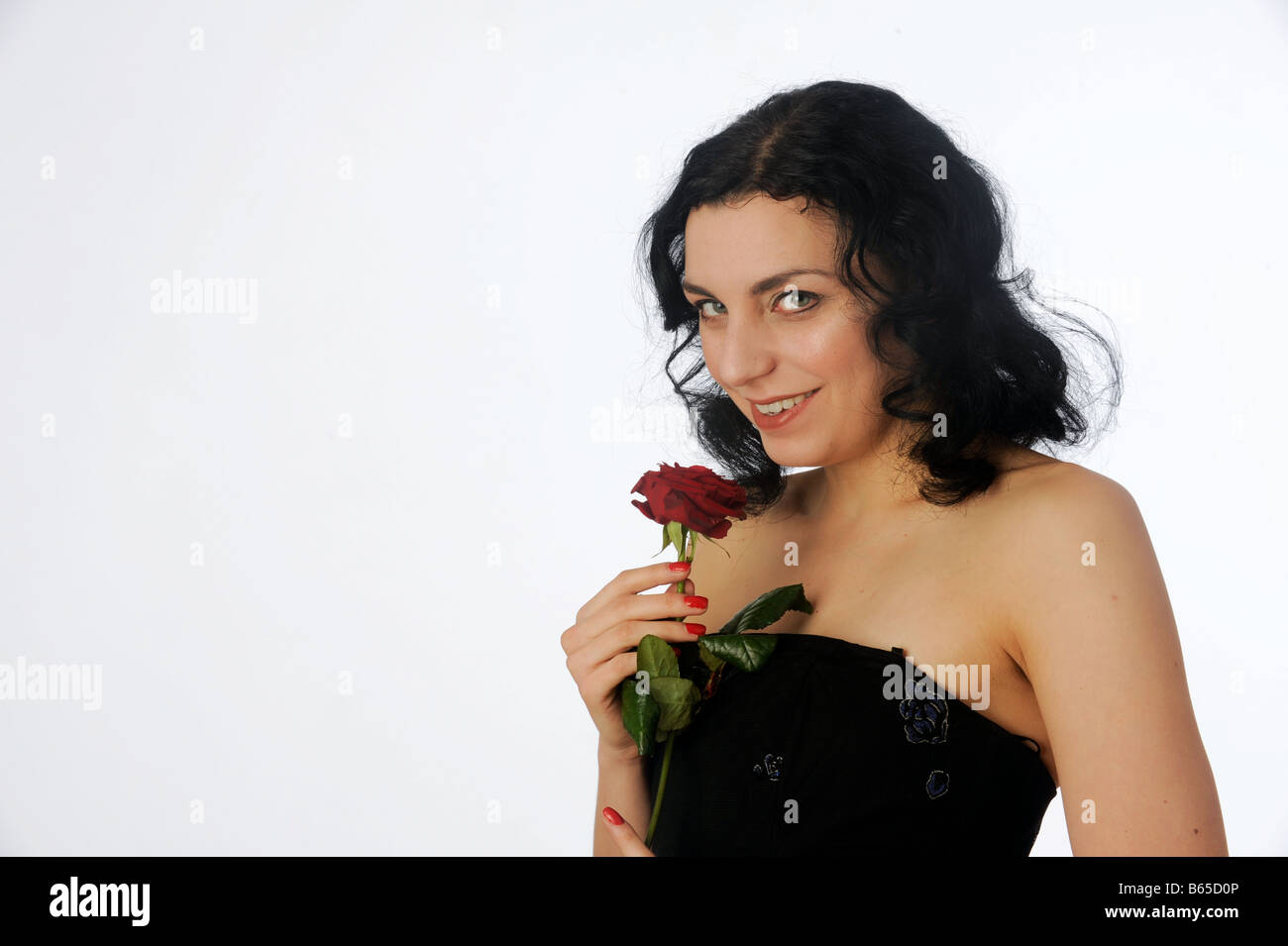 Looking and smelling a red rose hi-res stock photography and images - Alamy