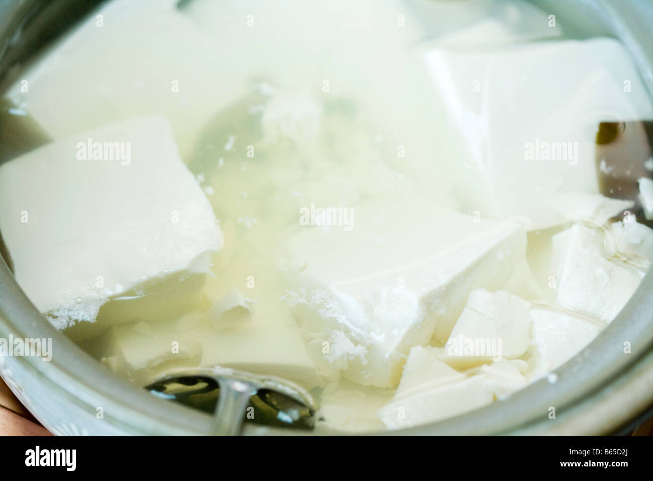 Tofu soaking in water, close-up Stock Photo - Alamy