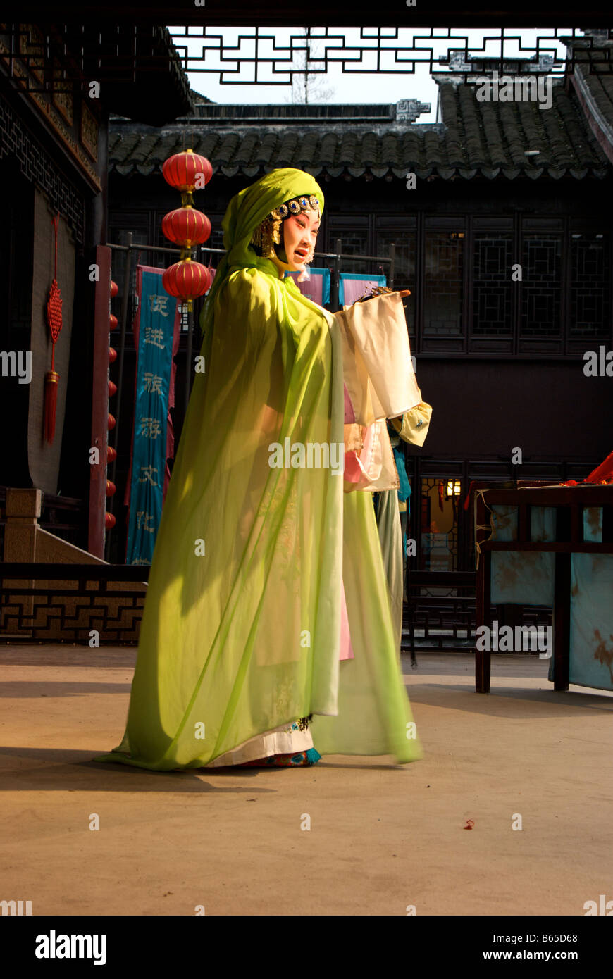 Female Chinese opera star performing classical aria on stage in Water ...