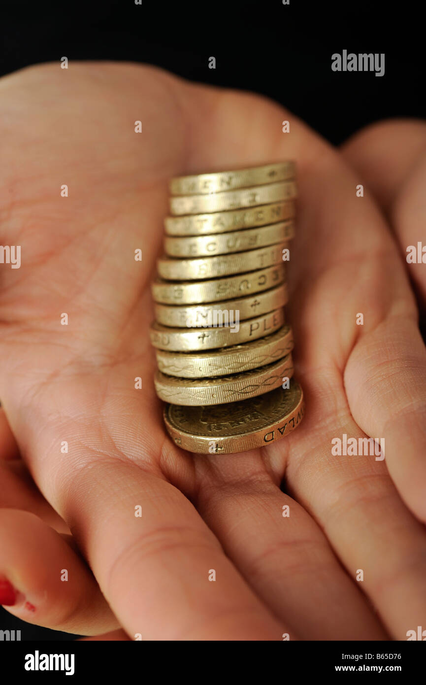 Uk coin hand woman hi-res stock photography and images - Alamy