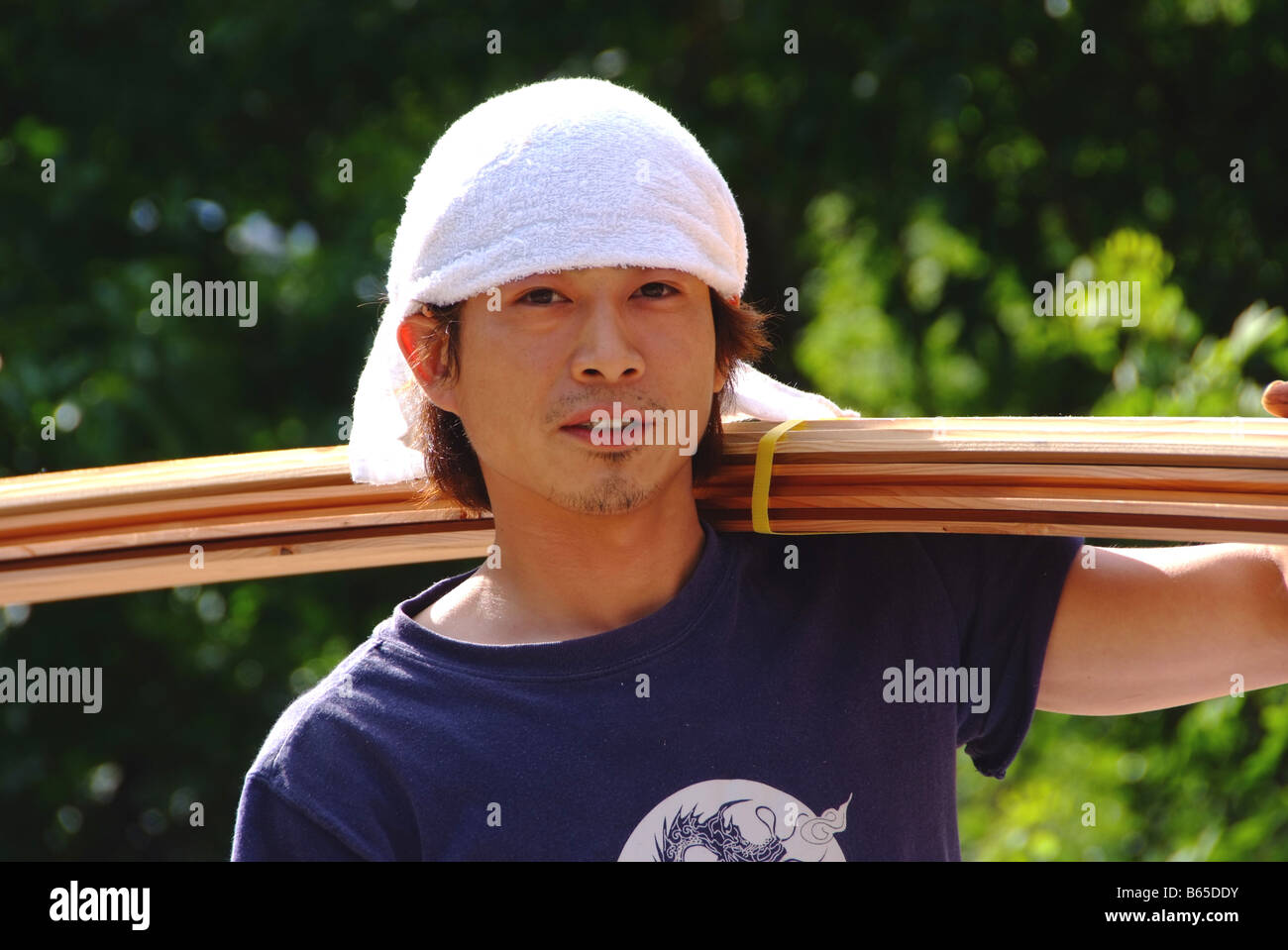 A young Japanese carpenter building a house Stock Photo - Alamy