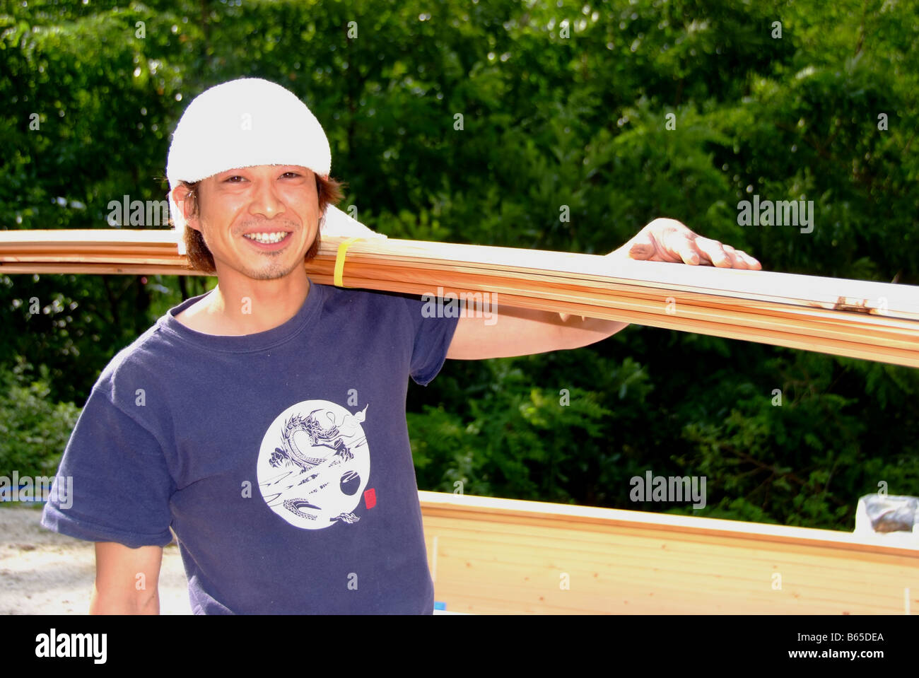 A young Japanese carpenter building a house Stock Photo - Alamy