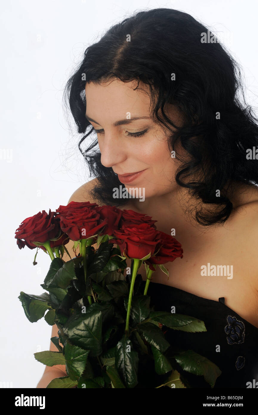 Woman with a bunch of Red Roses Stock Photo - Alamy