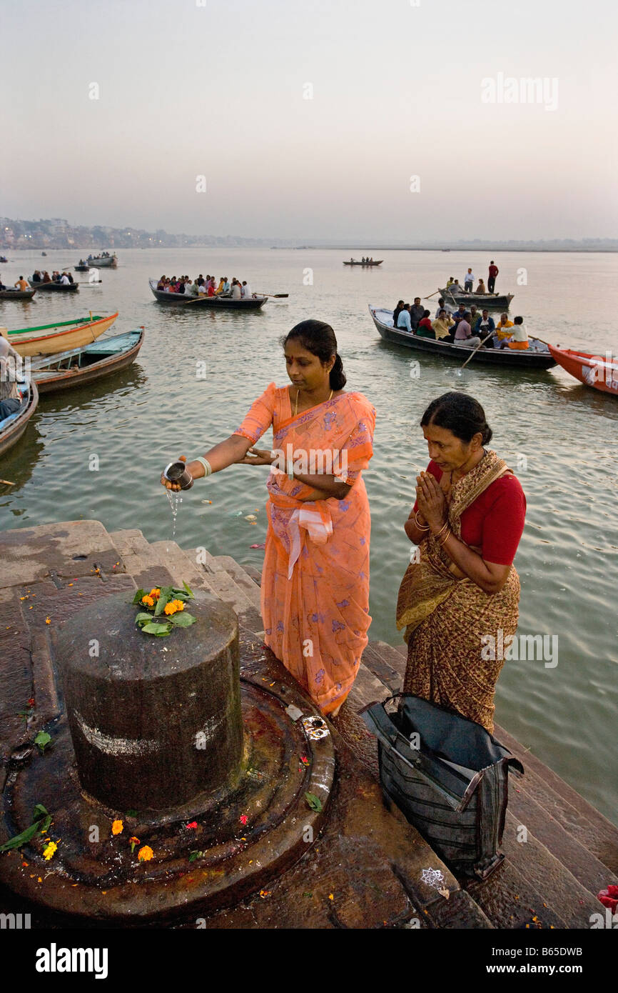 India, Uttar Pradesh, Varanasi, Ganga river, Women performing puja, an ...