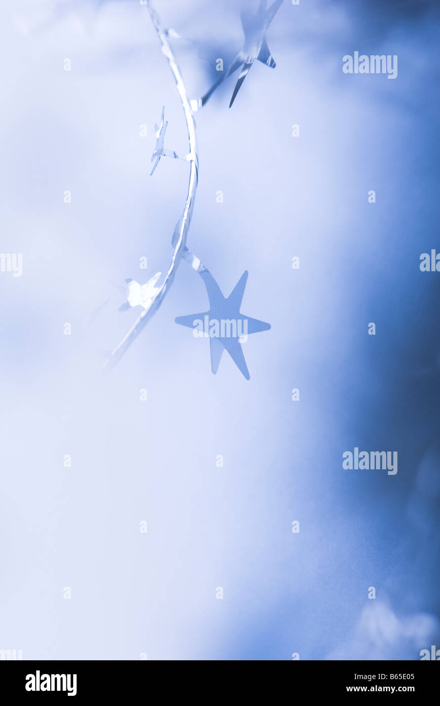 Star hanging from garland, close-up Stock Photo - Alamy