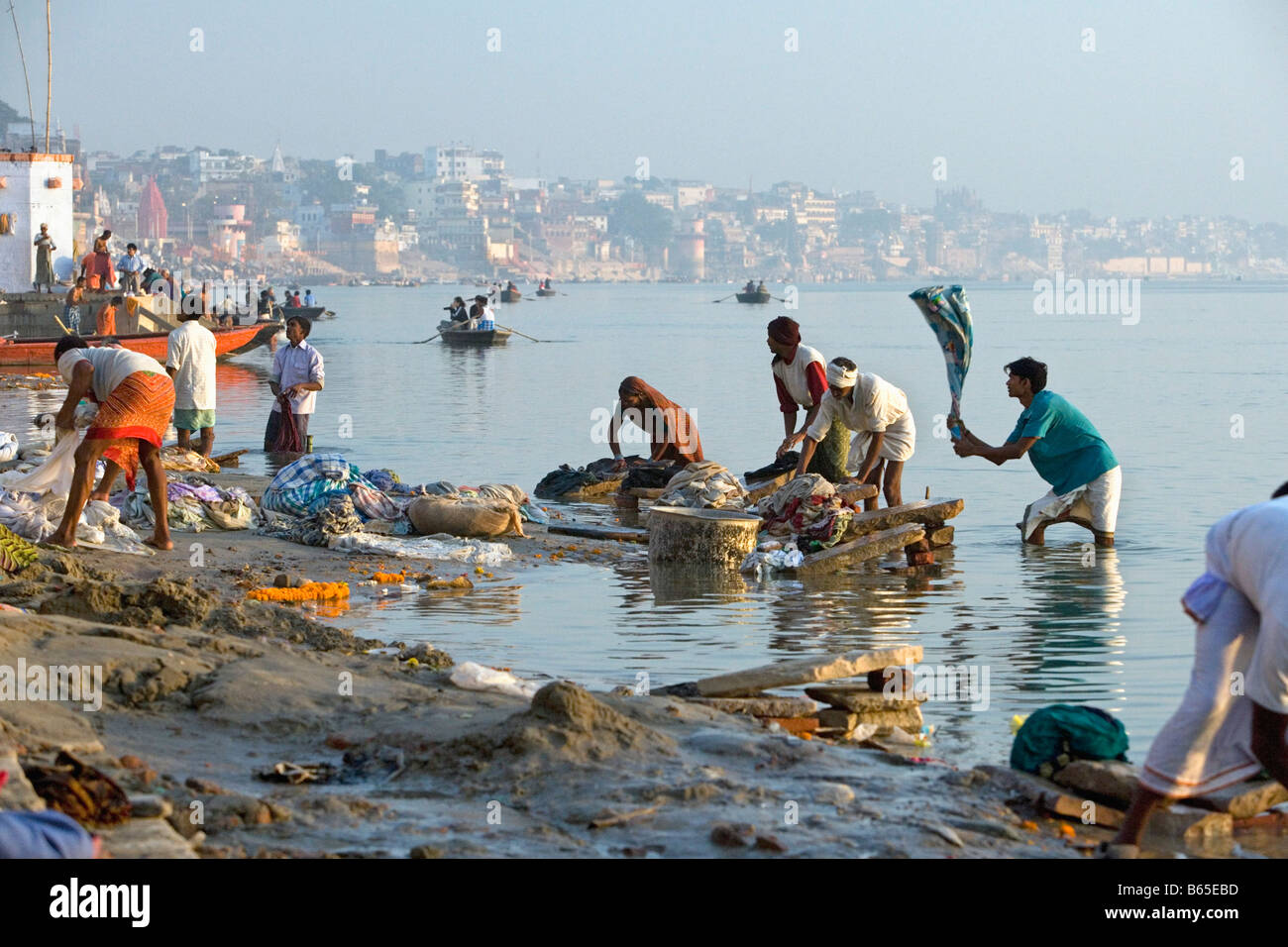 India, Uttar Pradesh, Varanasi, Ganga river, People washing clothes ...