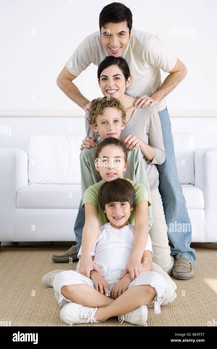 Family lined up one behind the another, shortest to tallest, posing for ...
