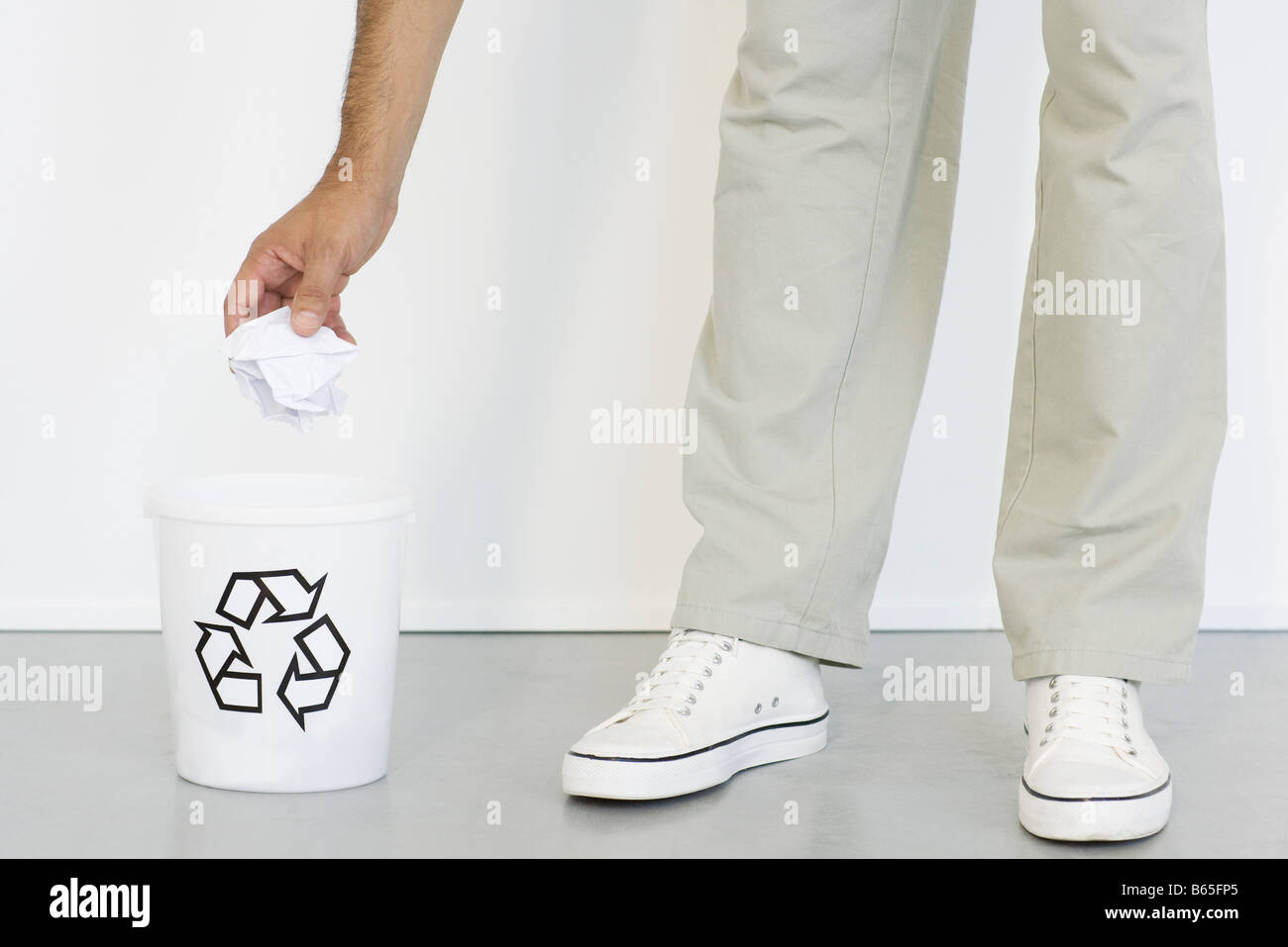 Placing paper into recycle bin hi-res stock photography and images - Alamy