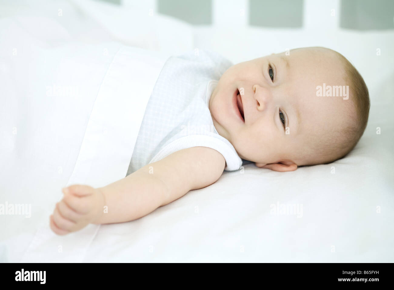 Baby lying on back, smiling, close-up Stock Photo - Alamy