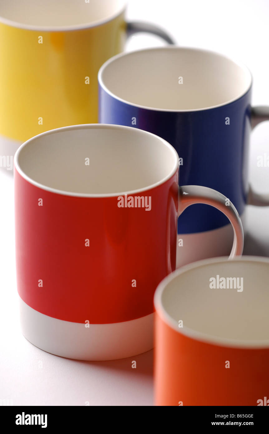 Four coloured mugs Stock Photo - Alamy