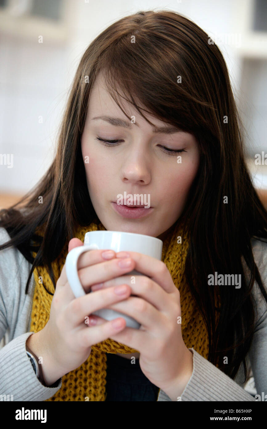 Young Girl drinking Tea Stock Photo - Alamy