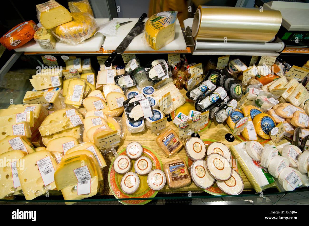 Cheese on display in French Supermarket Stock Photo - Alamy
