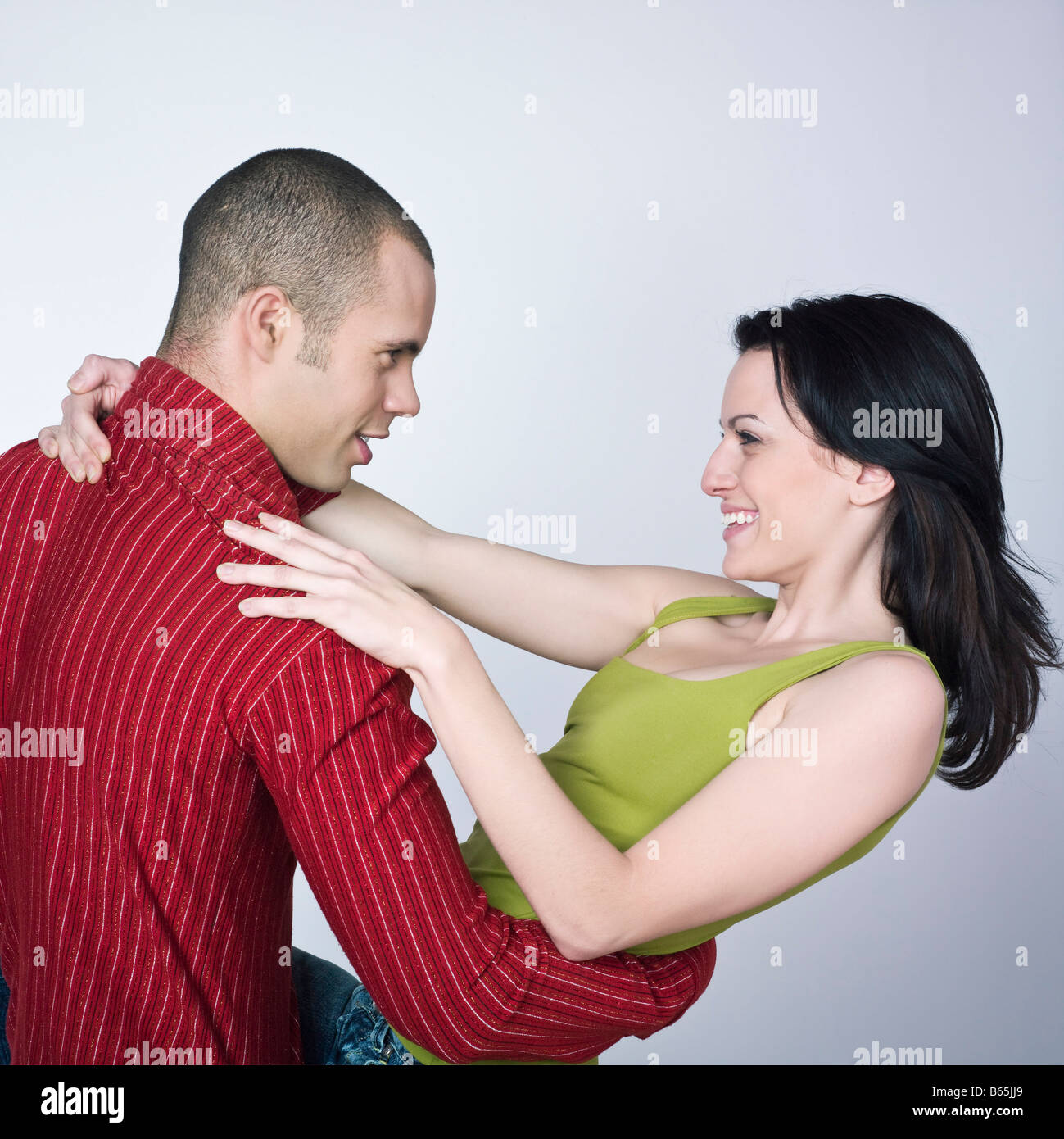 one young loving couple dancing hug smiling portrait on isolated ...
