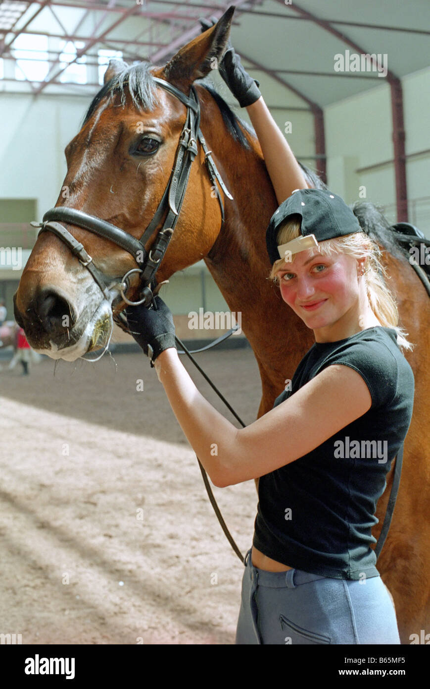 smiling equestrian woman portrait Stock Photo - Alamy