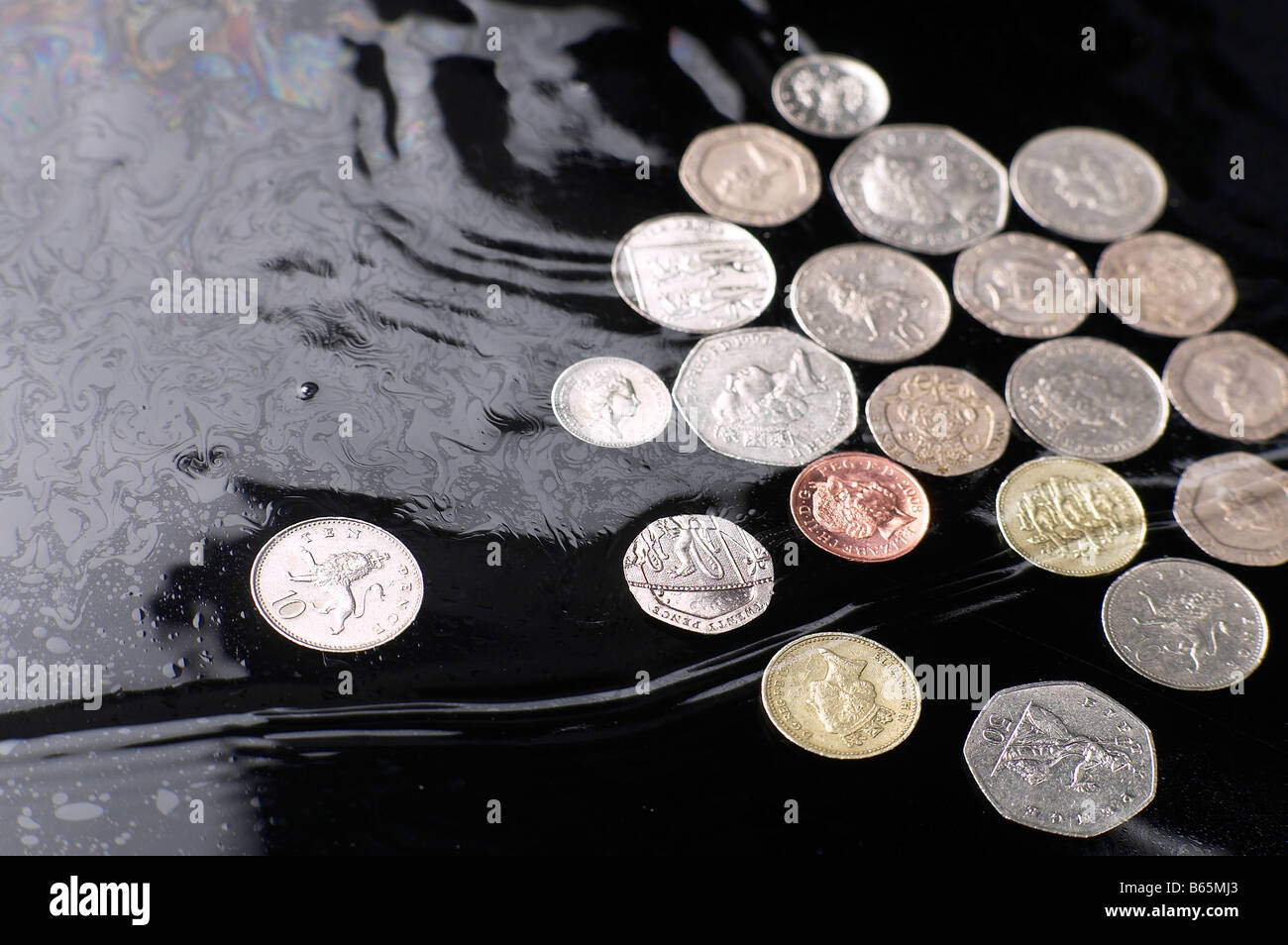 BRITISH MONEY SINKING IN MURKY WATERS Stock Photo - Alamy