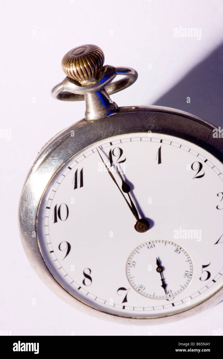 A silver Swiss pocket watch with shadow on a white background Stock ...