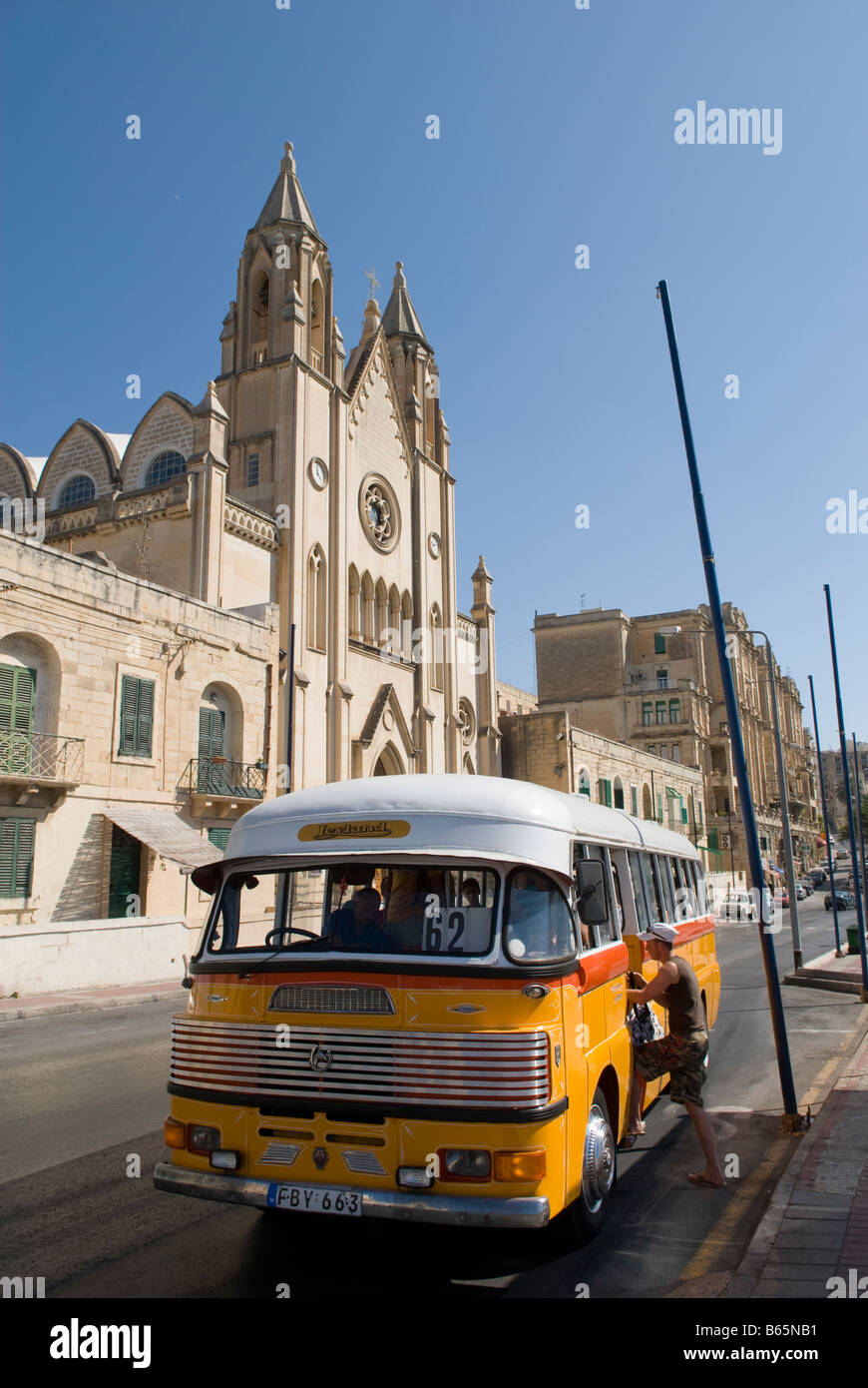 Person entering bus at bus stop near Carmelite Church, Balluta Bay ...