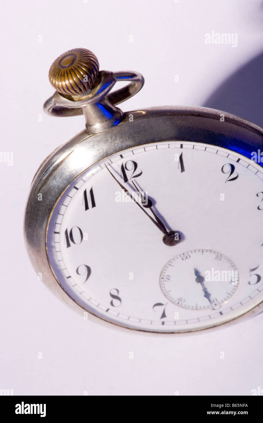 A silver Swiss pocket watch with shadow on a white background Stock ...