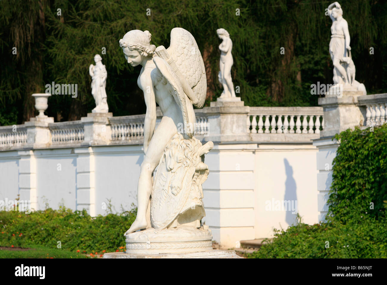 A neoclassical statue of an angel in the gardens of the 18th century ...
