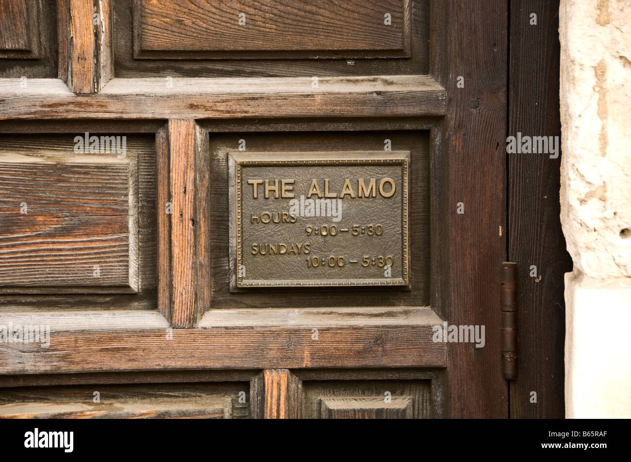 the alamo mission shrine monument marker at carved wood entrance door ...