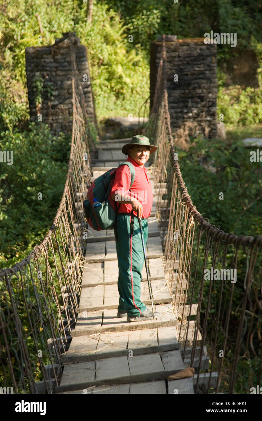 Crossing a rope bridge on the way to Ghandruk village above the Modi ...