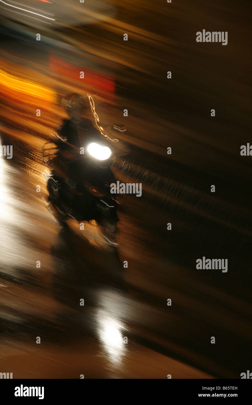 fast motorbike rider heavy rain at night in town Stock Photo - Alamy