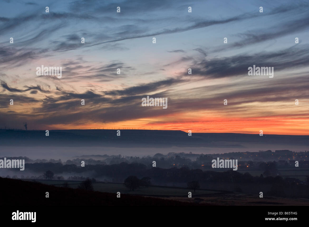 The view from Baildon Moor at sunset, as mist fills the Aire Valley at ...