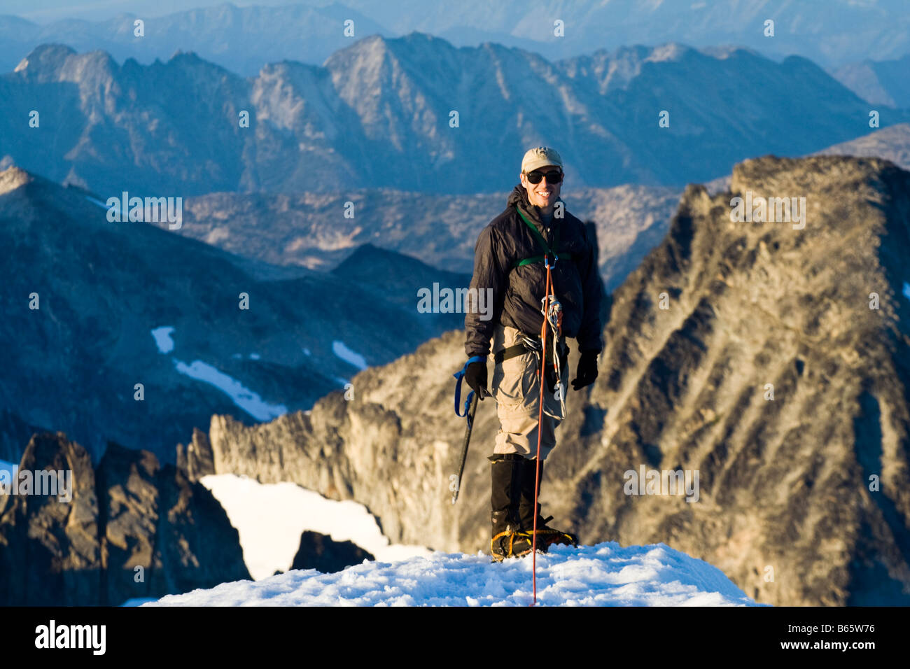 Man stands atop mountain peak hi-res stock photography and images - Alamy
