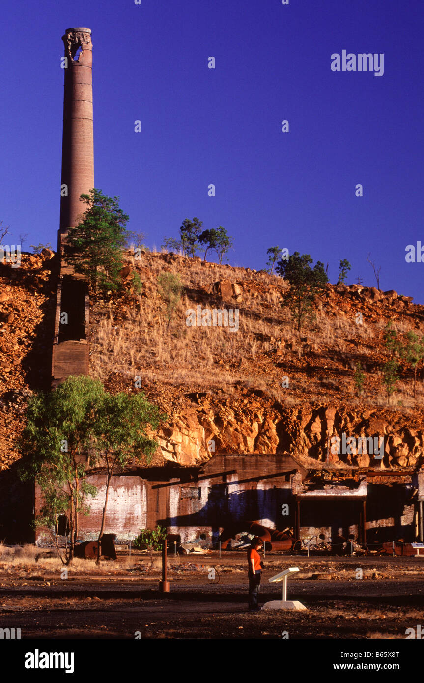 A visitor to the Iron Ore Smelter at Chillagoe reads an information ...