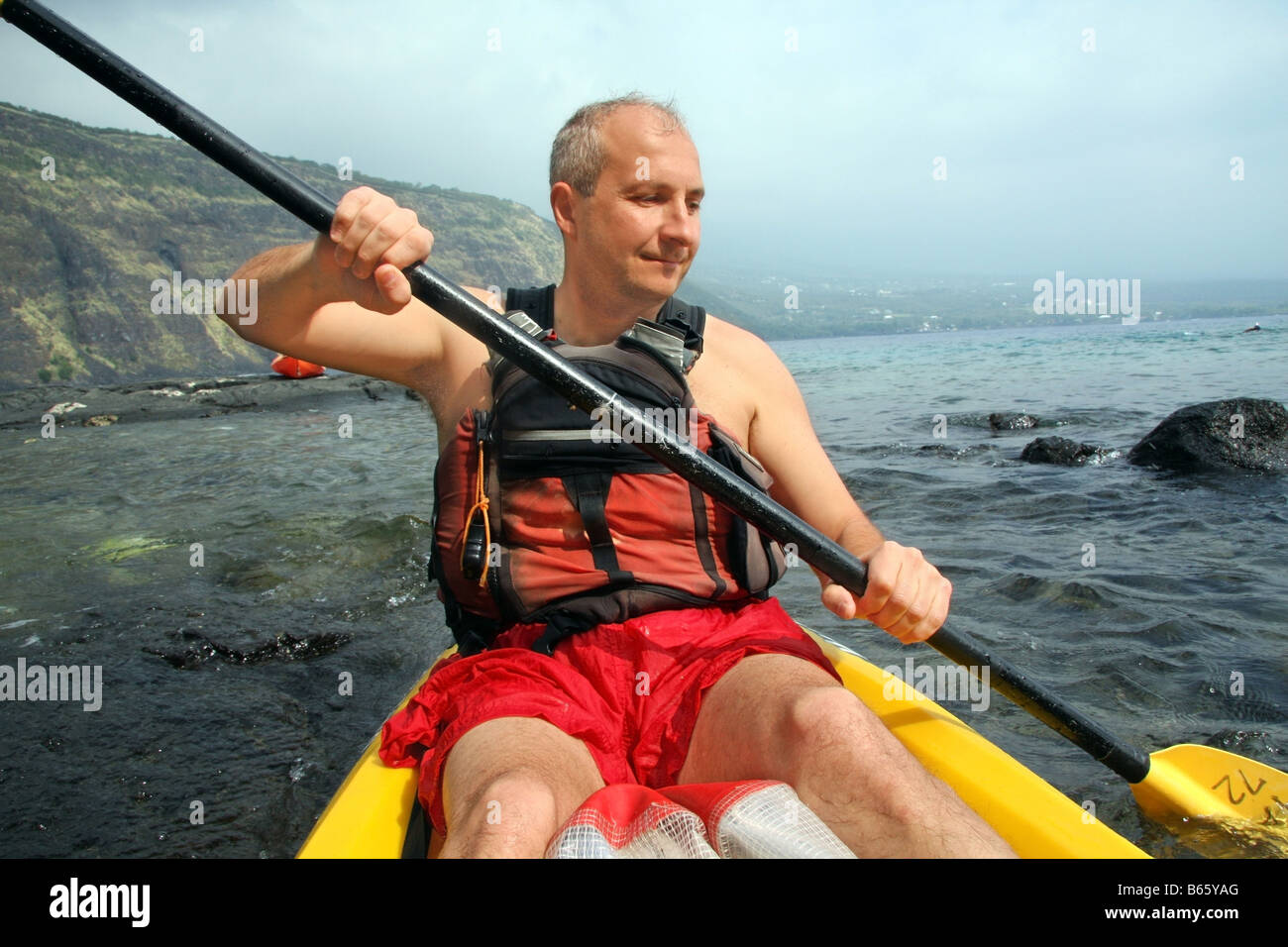 Mature man kayaking in the ocean on Big Island Hawaii Stock Photo - Alamy