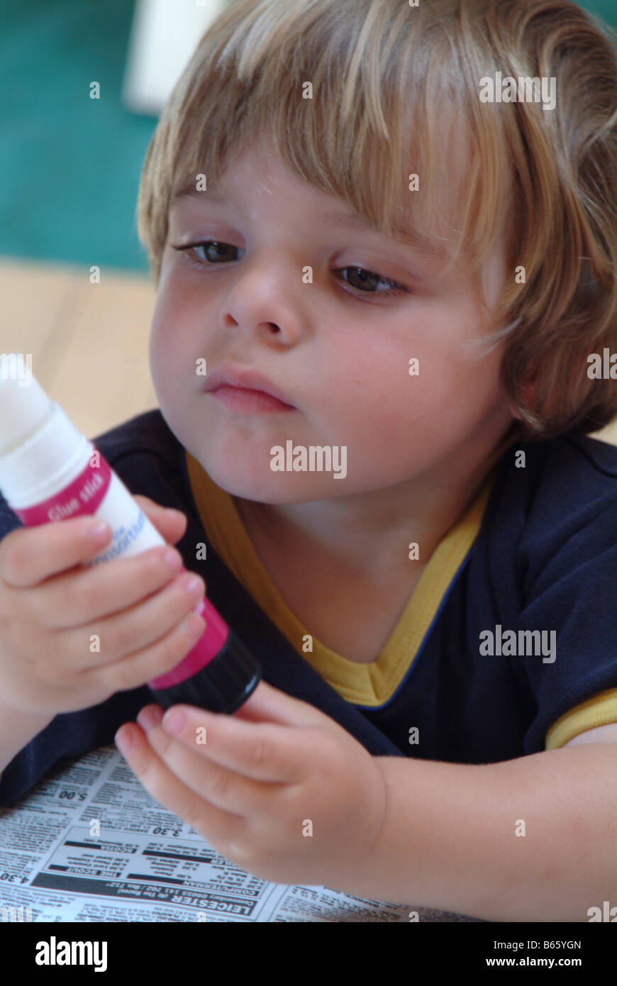 Sticking child glue hi-res stock photography and images - Alamy