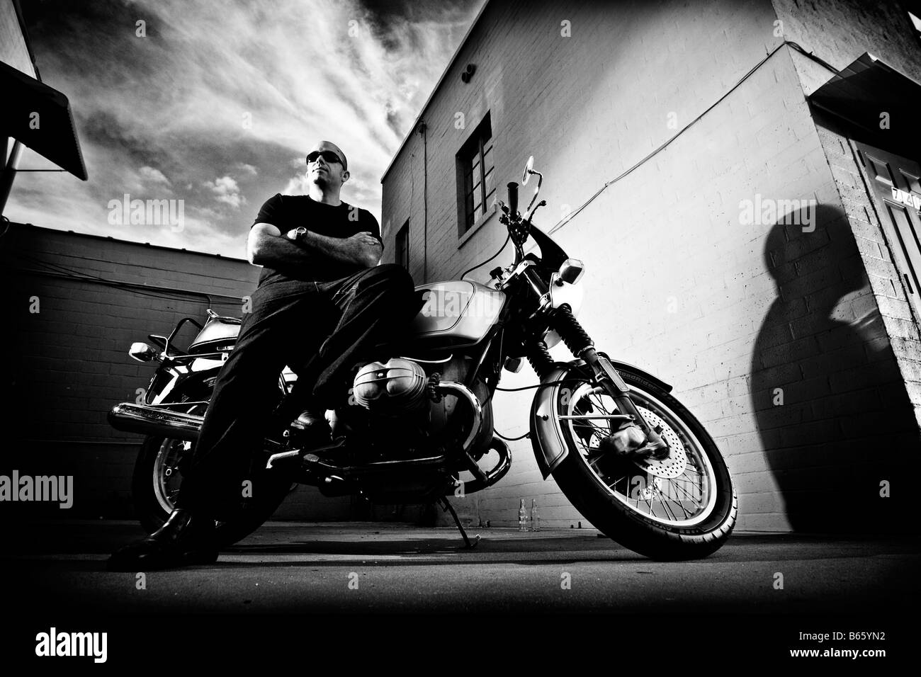 A man sits on his motorcycle and poses for the camera A perfect ...