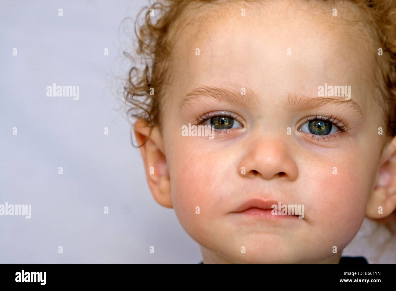 Sad faced toddler boy Stock Photo - Alamy