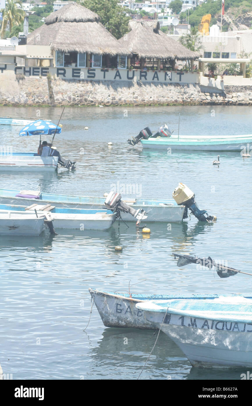 Lots of fiberglass fishing boats anchored off shore in Mexico Stock ...